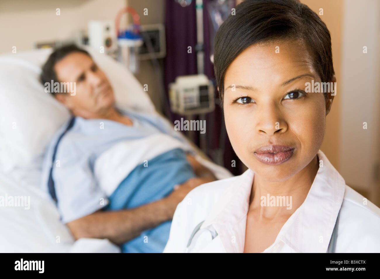 Doctor Looking Serious, Standing In Hospital Room Stock Photo - Alamy