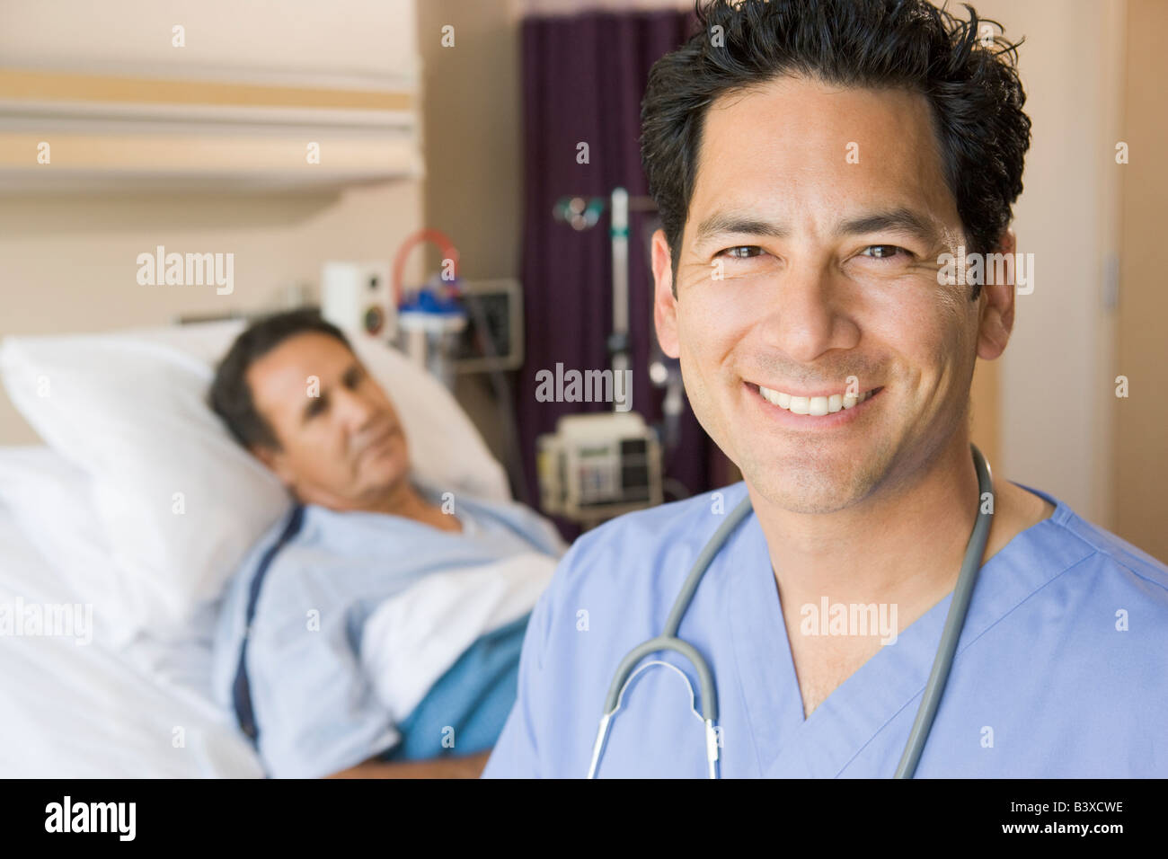 Doctor Smiling In Patients Room Stock Photo - Alamy