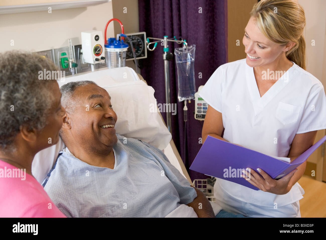 Doctor Making Notes About Patient Stock Photo - Alamy