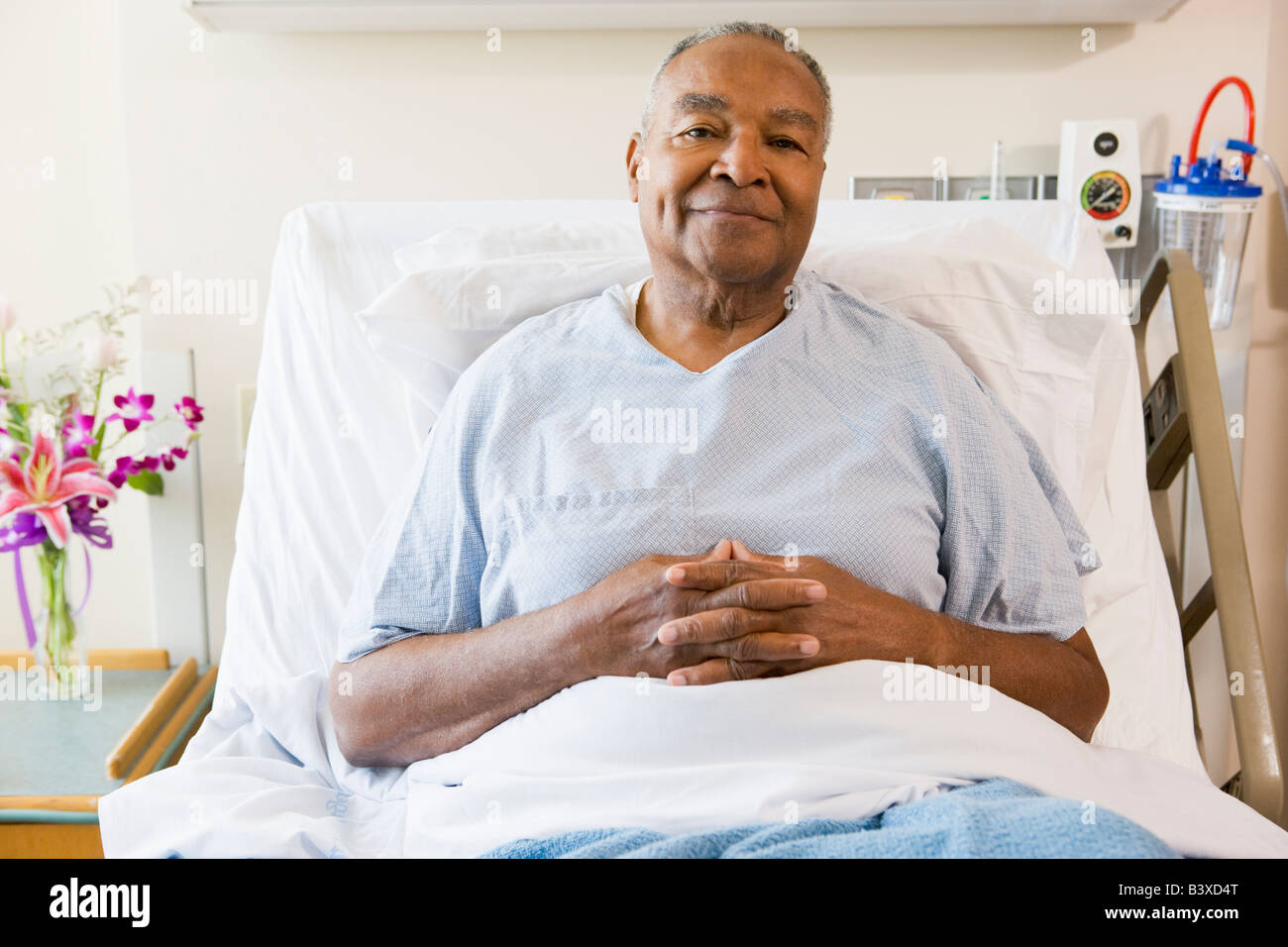 Senior Man Sitting In Hospital Bed Stock Photo - Alamy