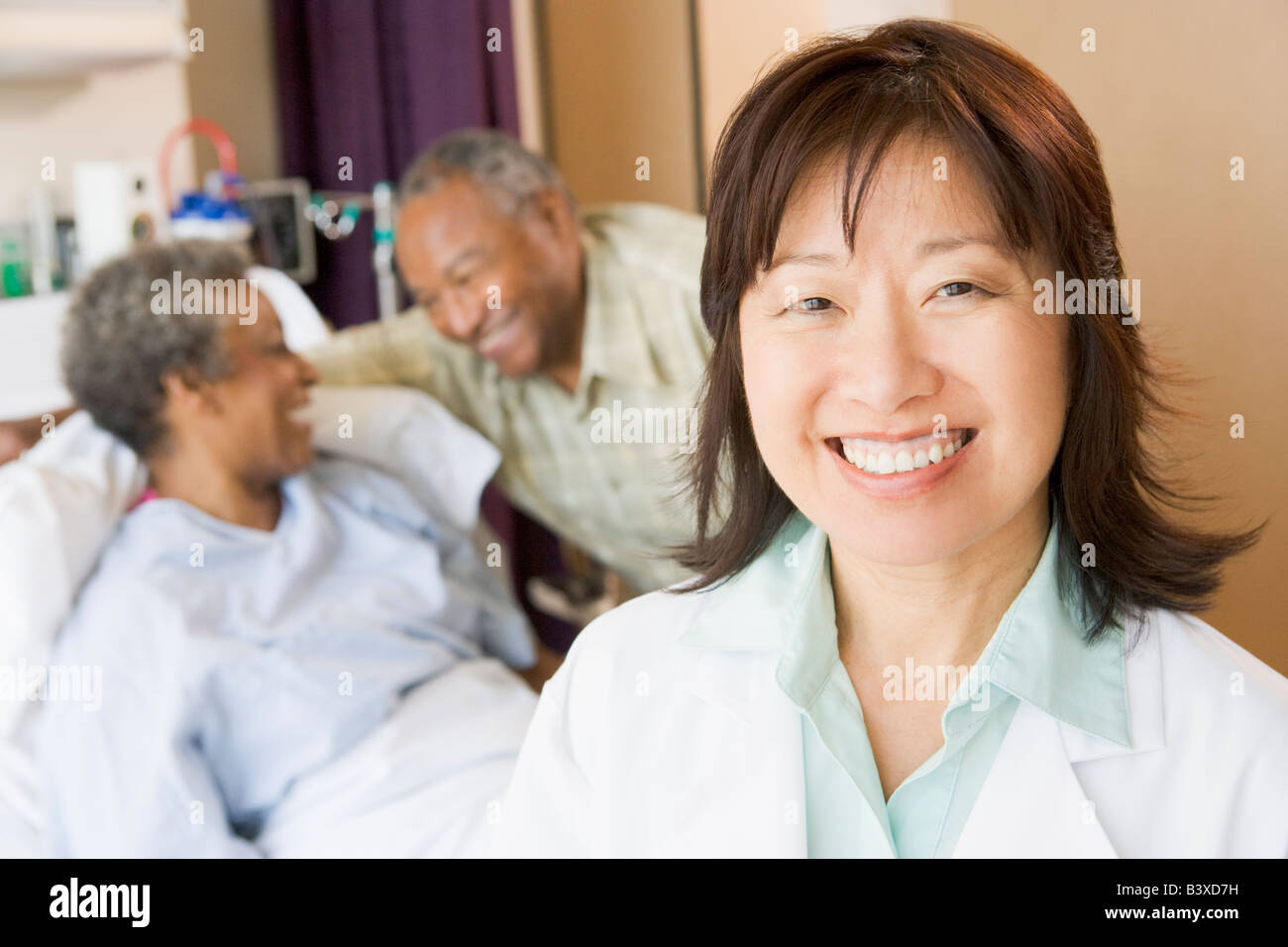 Nurse Smiling In Hospital Room Stock Photo - Alamy