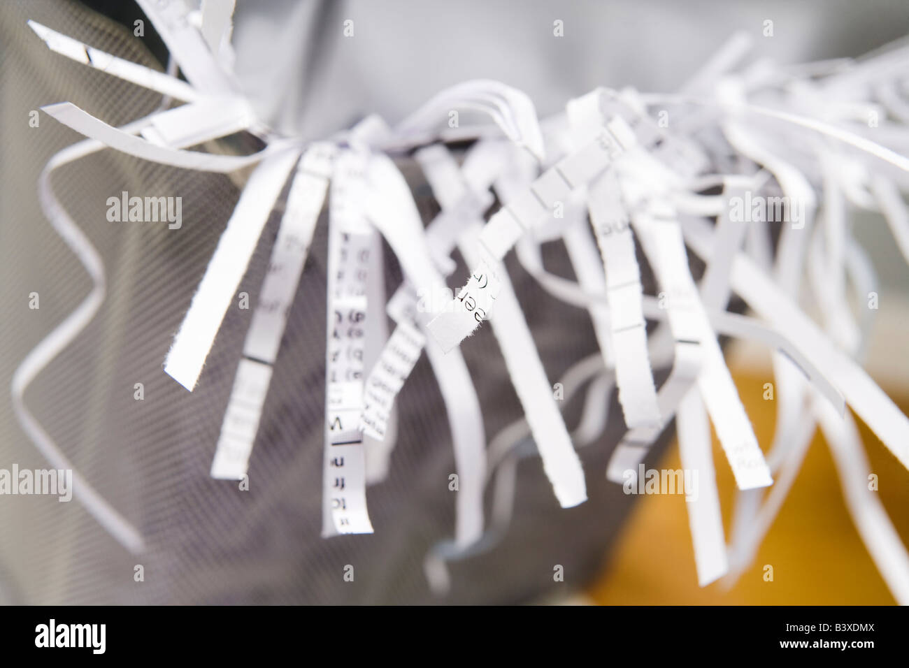 Close-Up Of An Overflowing Paper Shredder Stock Photo - Alamy