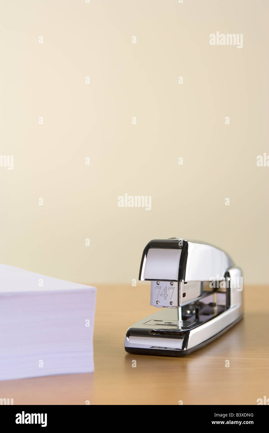 A Silver Stapler And A Pile Of Paperwork Stock Photo - Alamy