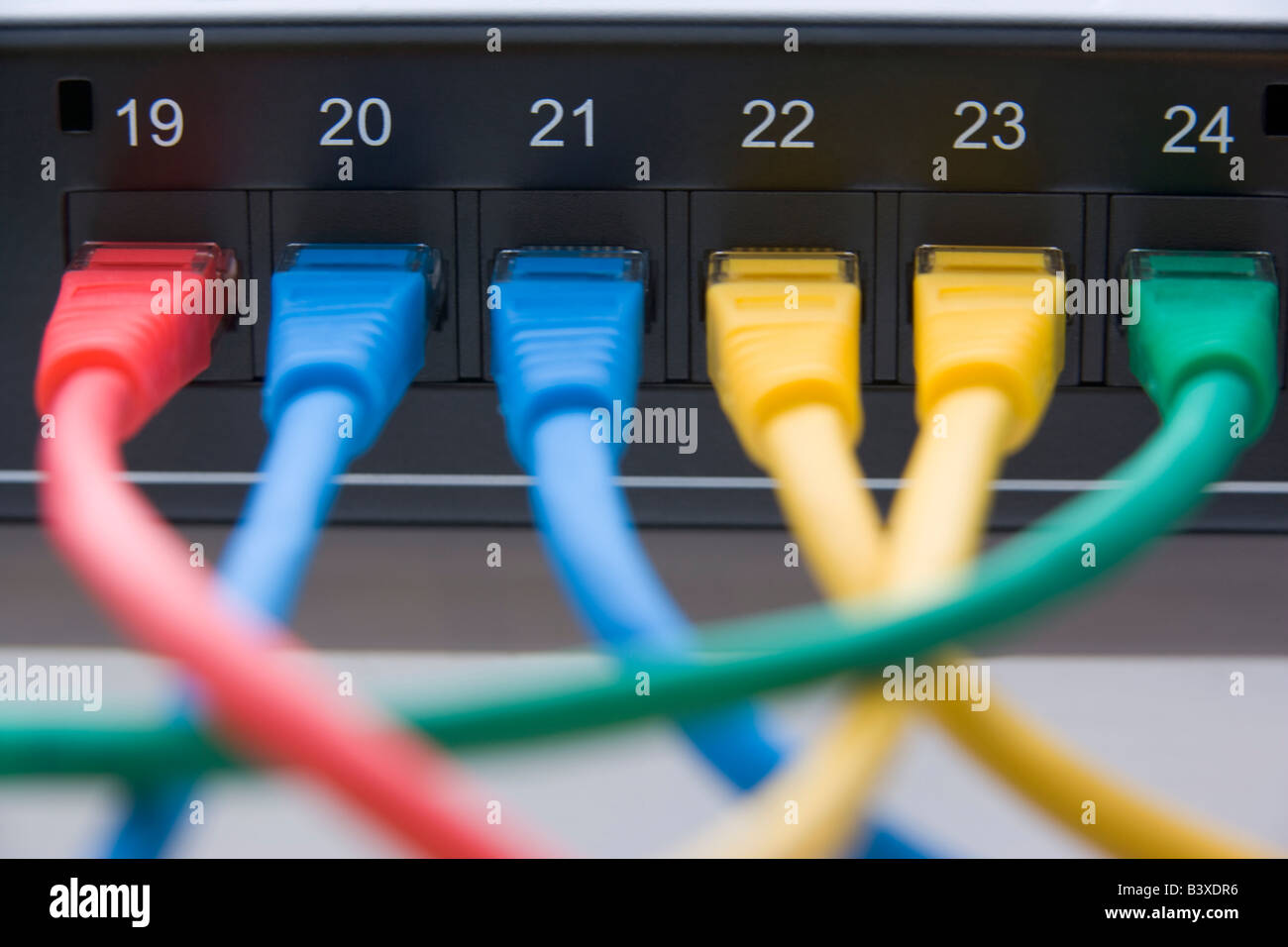 Computer Cables Connected To A Router Stock Photo - Alamy