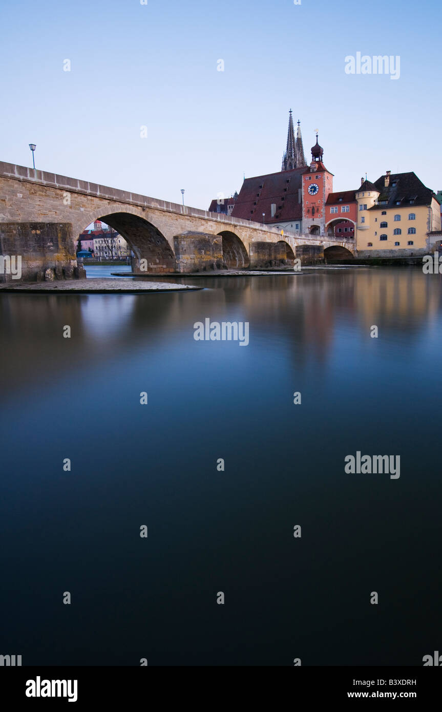 12th century stone bridge crosses Danube river with Saint Peters ...