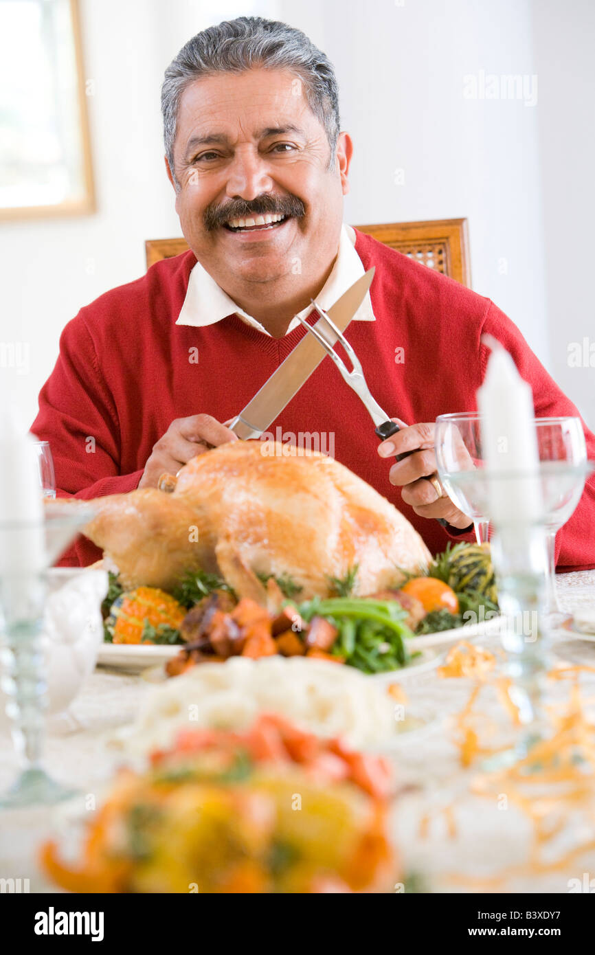 Senior Man Excitedly Getting Ready To Carve The Turkey Stock Photo - Alamy