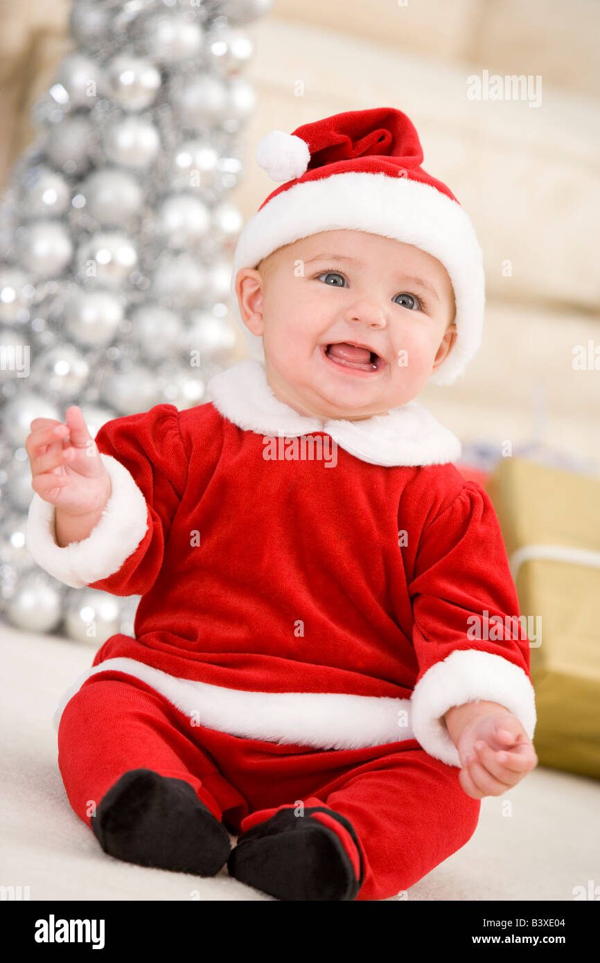 Baby In Santa Costume At Christmas Stock Photo - Alamy