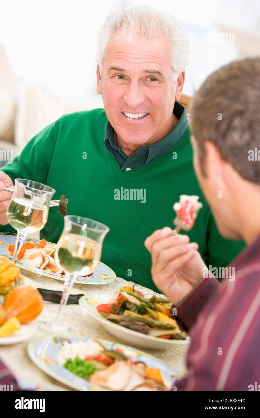 Father And Son At Christmas Dinner Stock Photo - Alamy