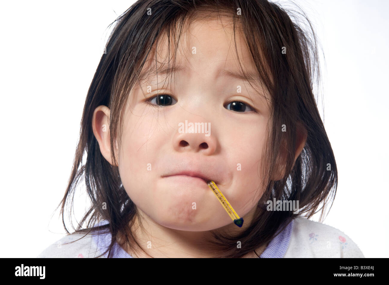 A young girl is sick and having her temperature taken Stock Photo - Alamy