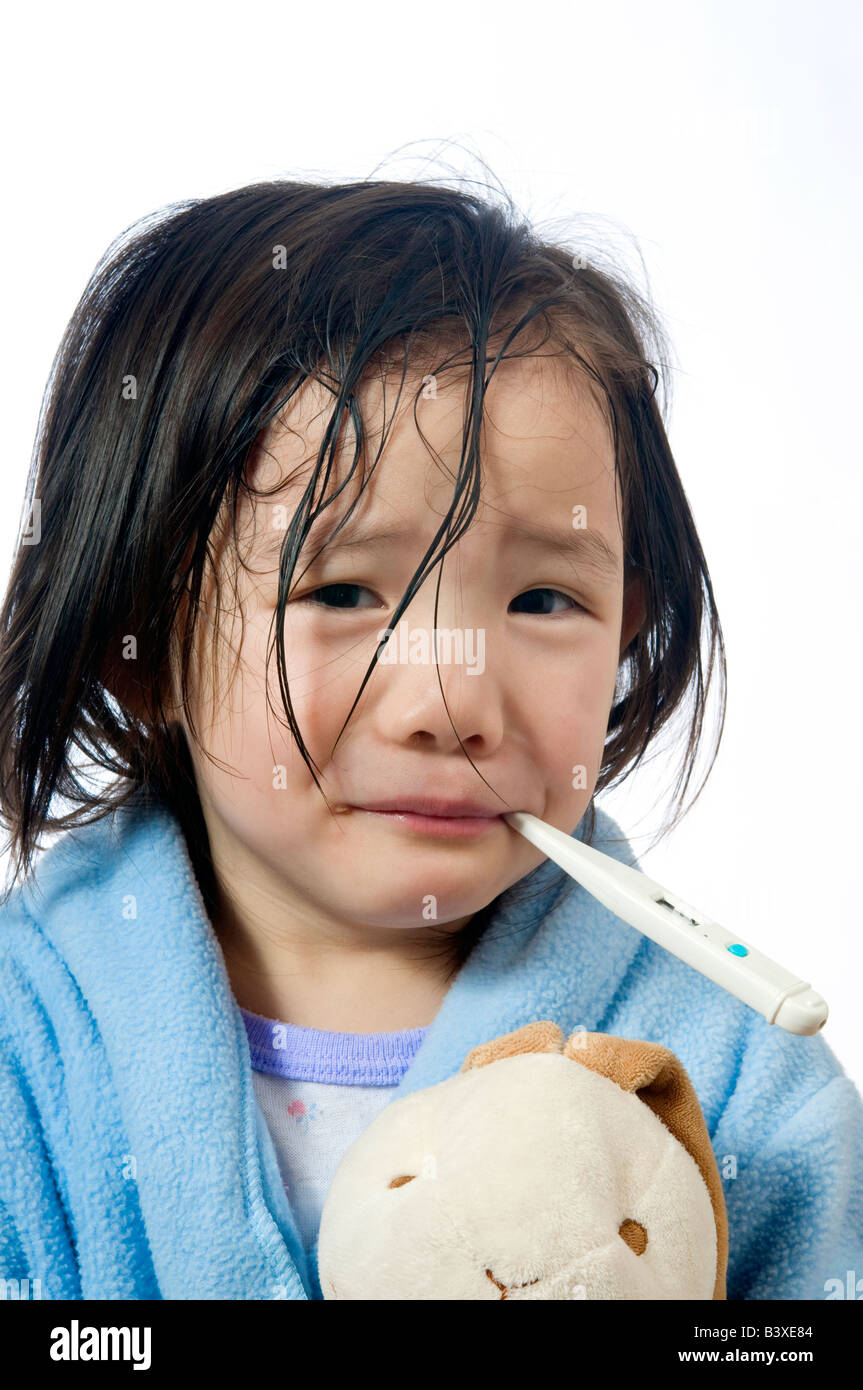 A young girl is sick and having her temperature taken Stock Photo - Alamy