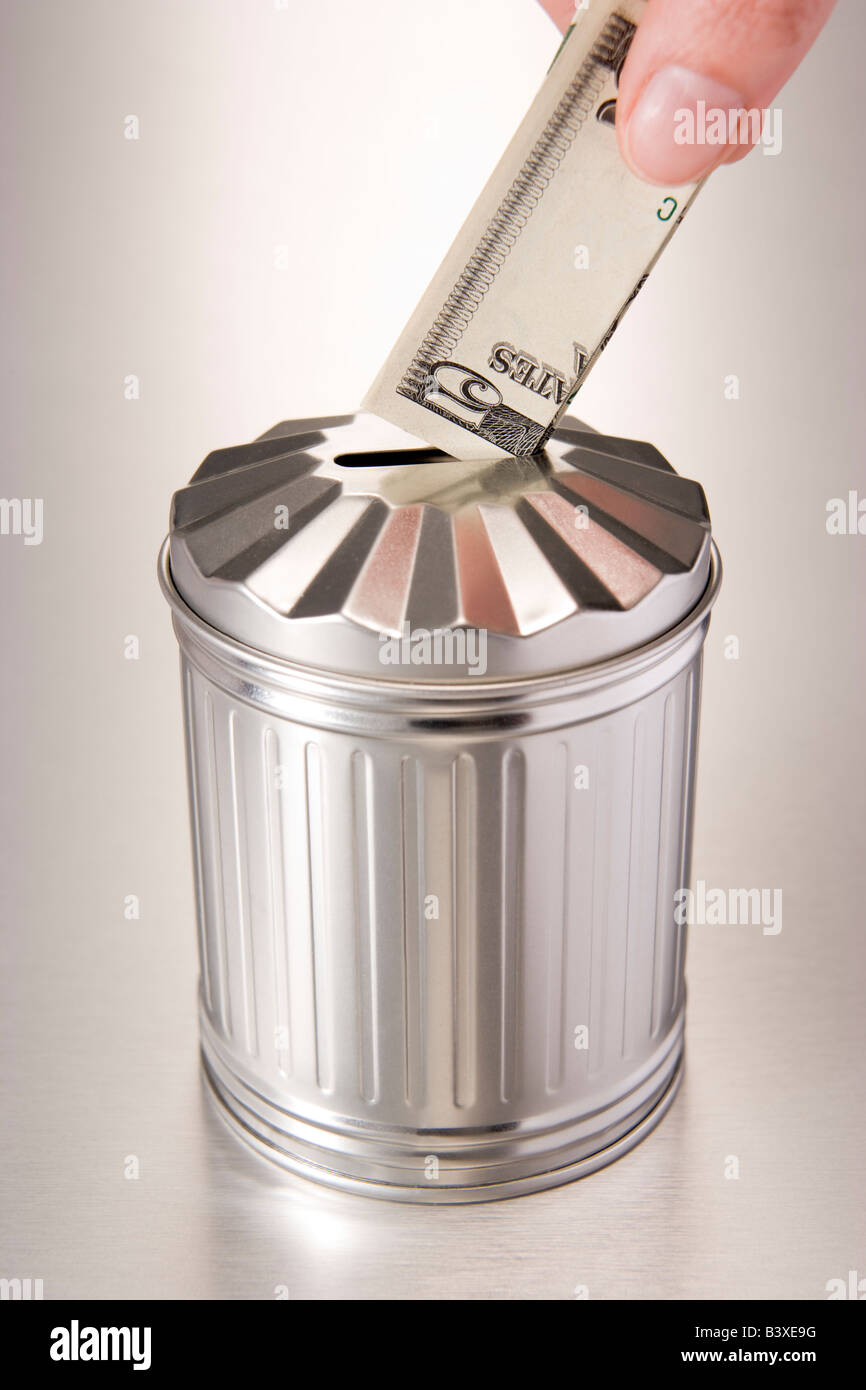 Throwing money down the drain hi-res stock photography and images - Alamy