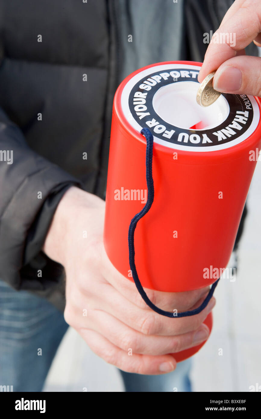 Donating money charity box hi-res stock photography and images - Alamy