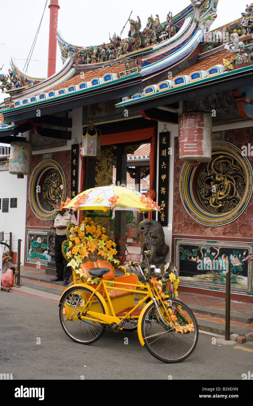 Trishaw or cyclo outside the Tan Choon Heng Chinese temple, Melaka ...