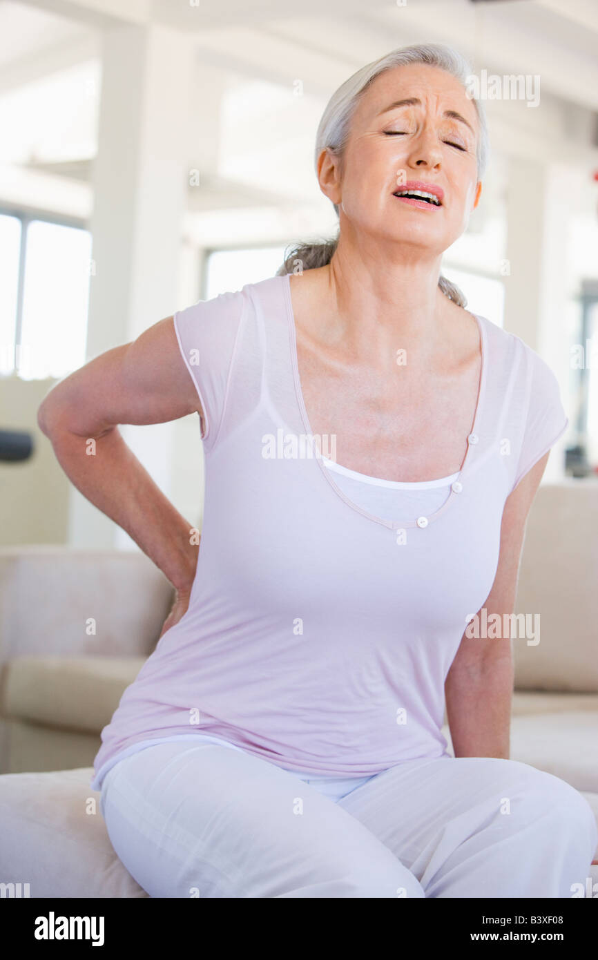 Woman With Back Pain Stock Photo - Alamy