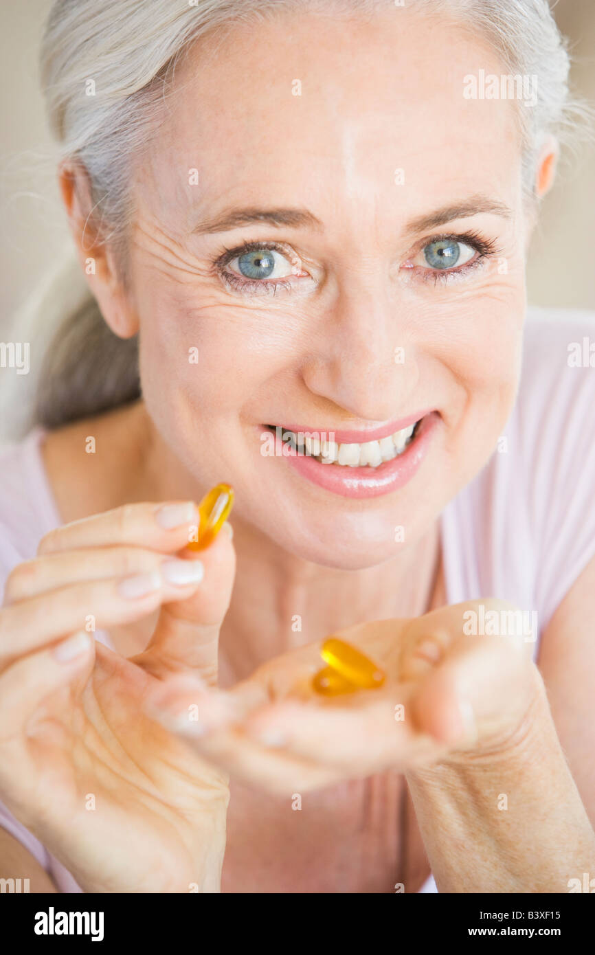 Woman Taking Pills Stock Photo - Alamy