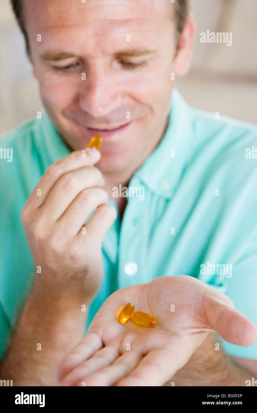 Man Taking Pills Stock Photo - Alamy