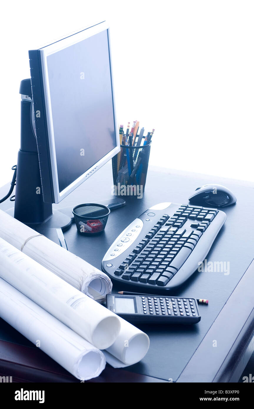 A professional desktop of an Engineer with drawings computer W B set ...