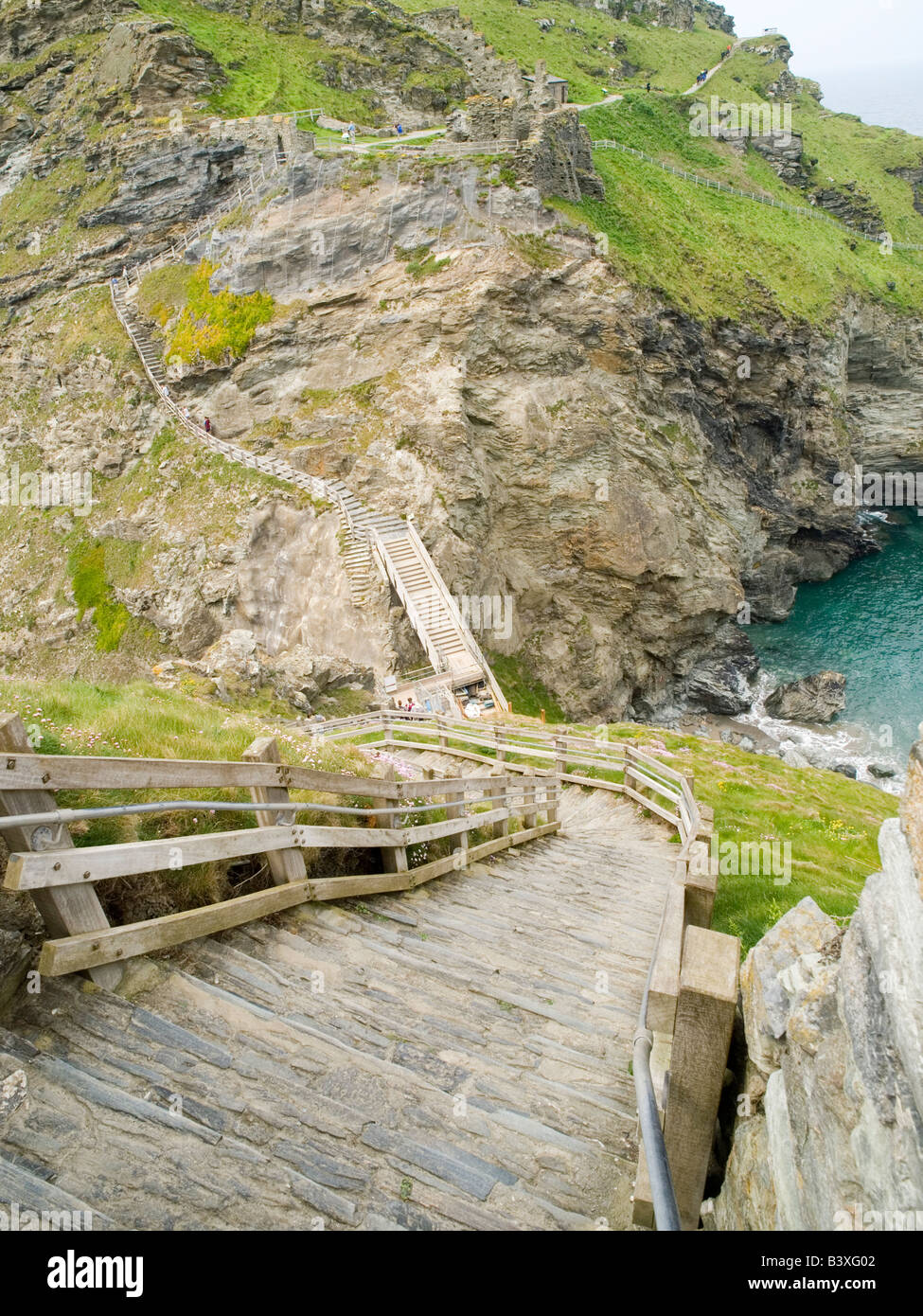 Steep stone steps leading down the side of the cliff at Tintagel Castle ...