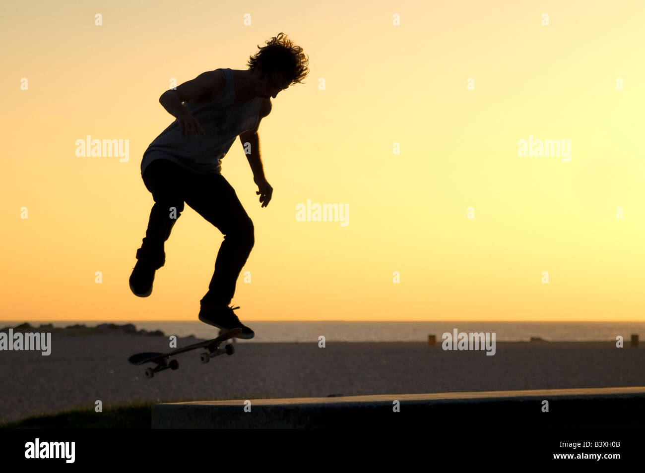Man kid beach sunset hi-res stock photography and images - Alamy