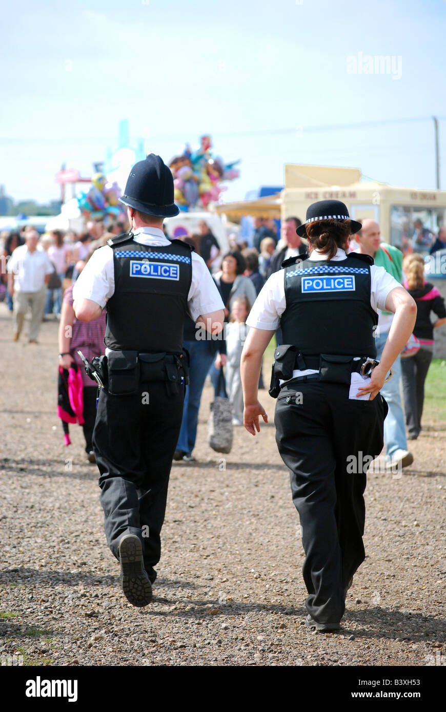 Two police at fair Stock Photo - Alamy