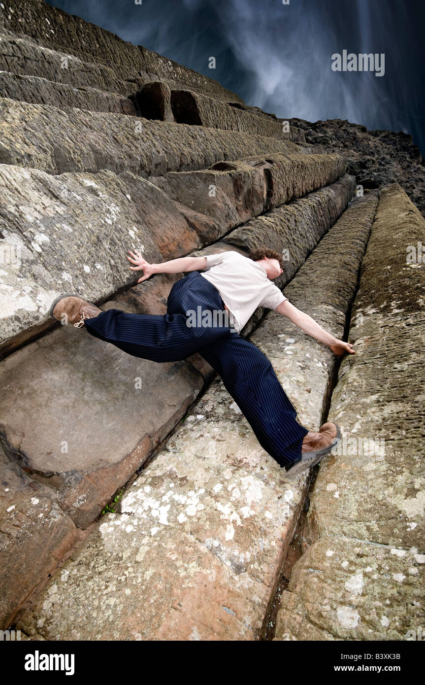 Man Climbing On The "pipe organ". Giants Causeway, Northern Ireland ...