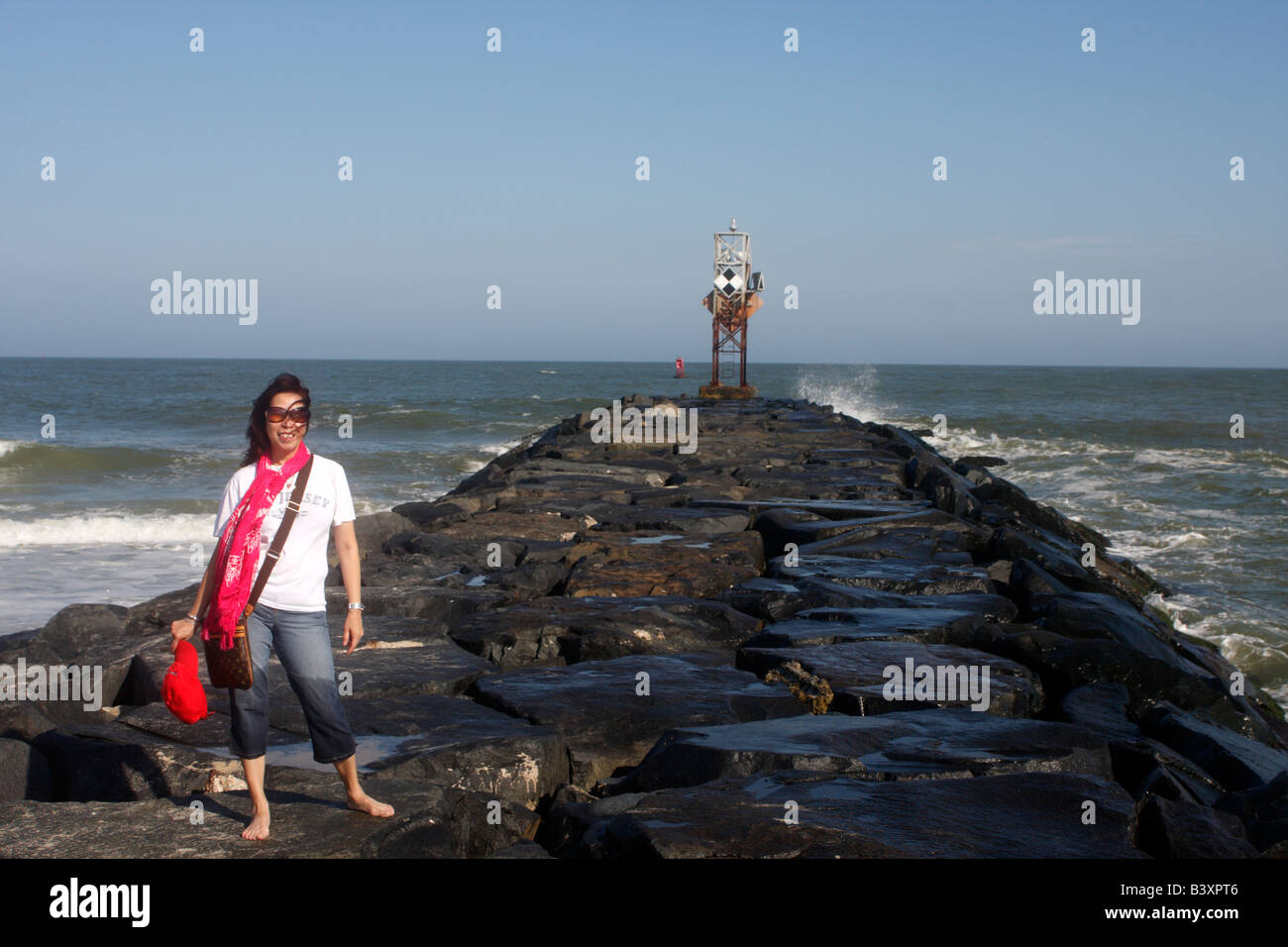 Woman stands smiling in city hi-res stock photography and images - Alamy