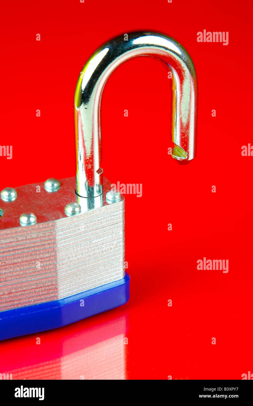 A padlock isolated against a red background Stock Photo - Alamy