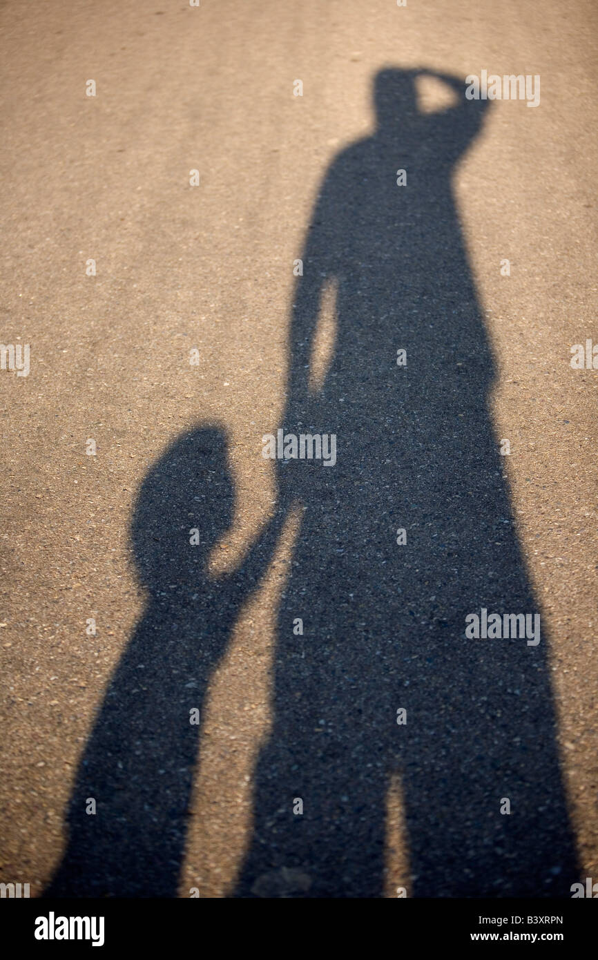 Shadow of young boy looking up at his Father Stock Photo - Alamy