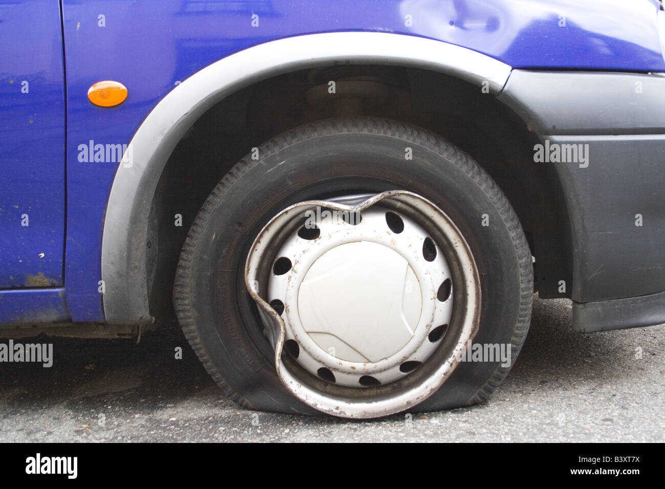 A small car that has had an accident damaging it s wheel rims Stock ...