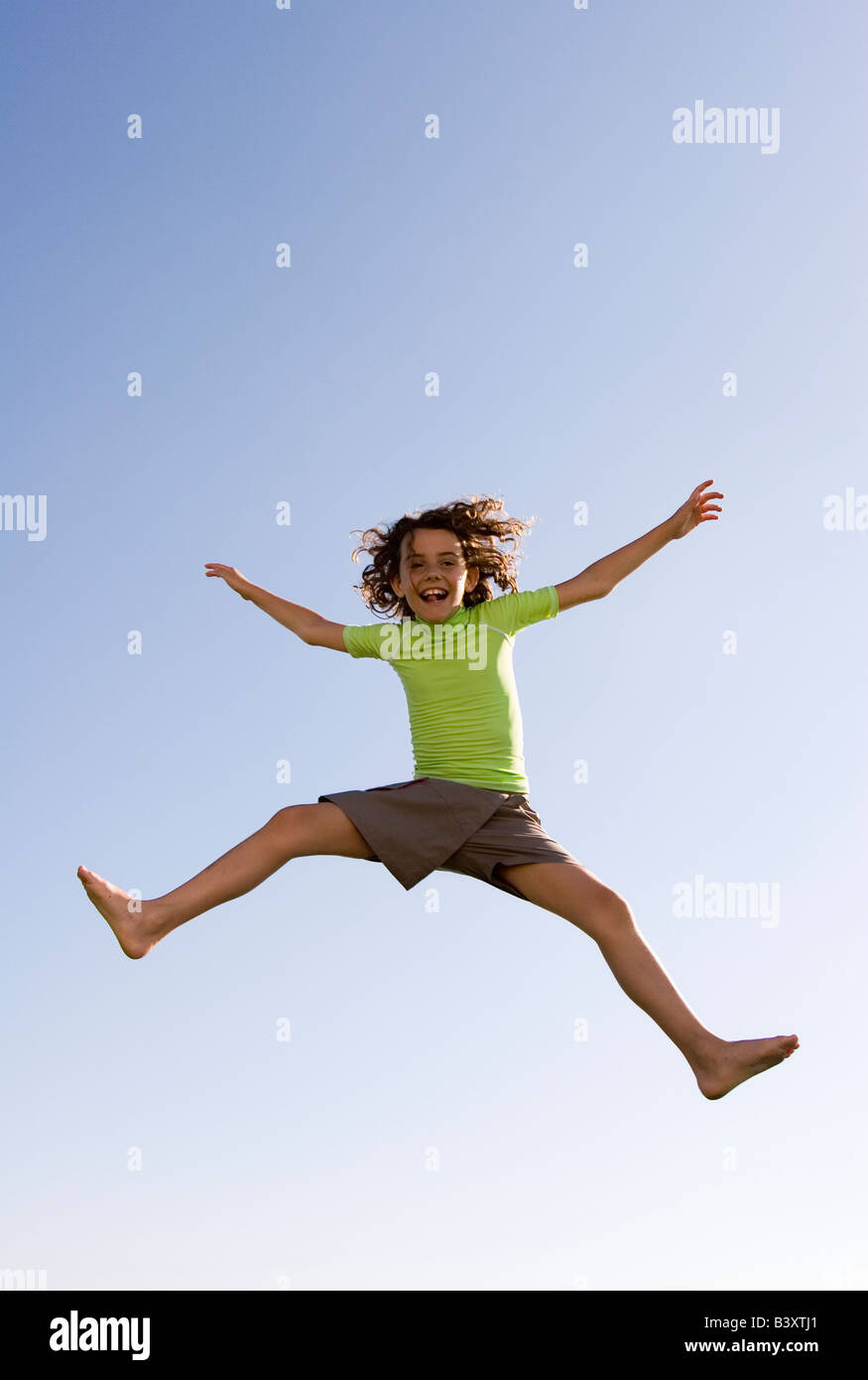 Girl jumping free air Stock Photo - Alamy