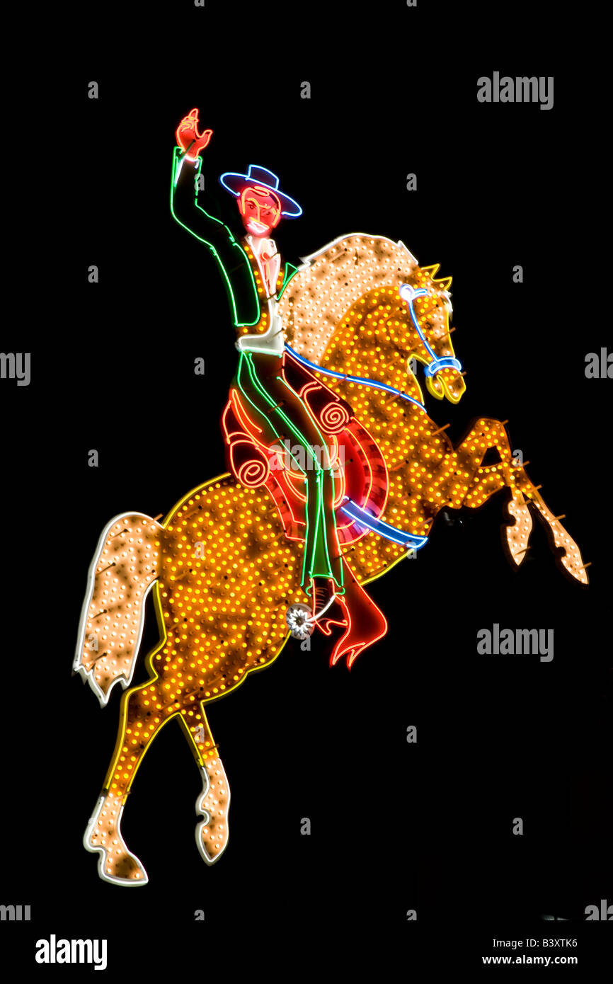 A glittering neon cowboy waves to visitors along Fremont Street in Las ...