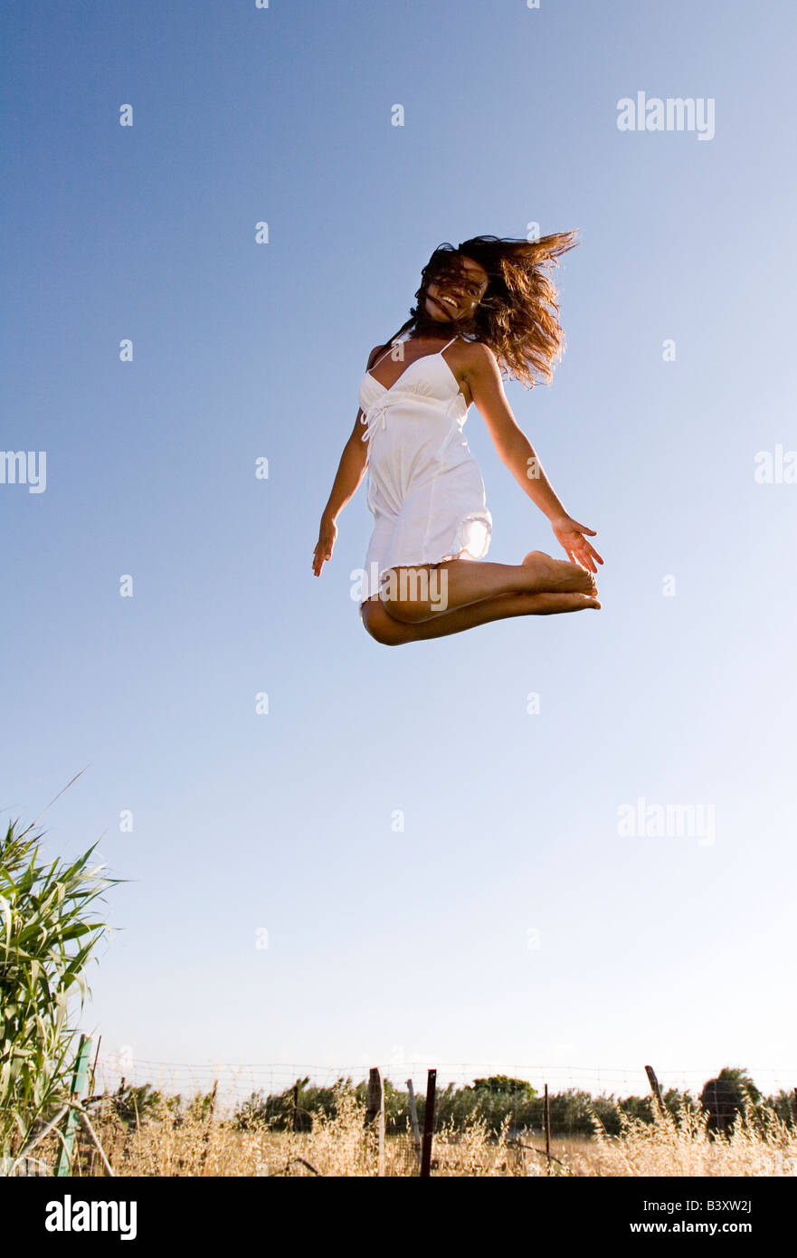Girl jumping free air Stock Photo - Alamy
