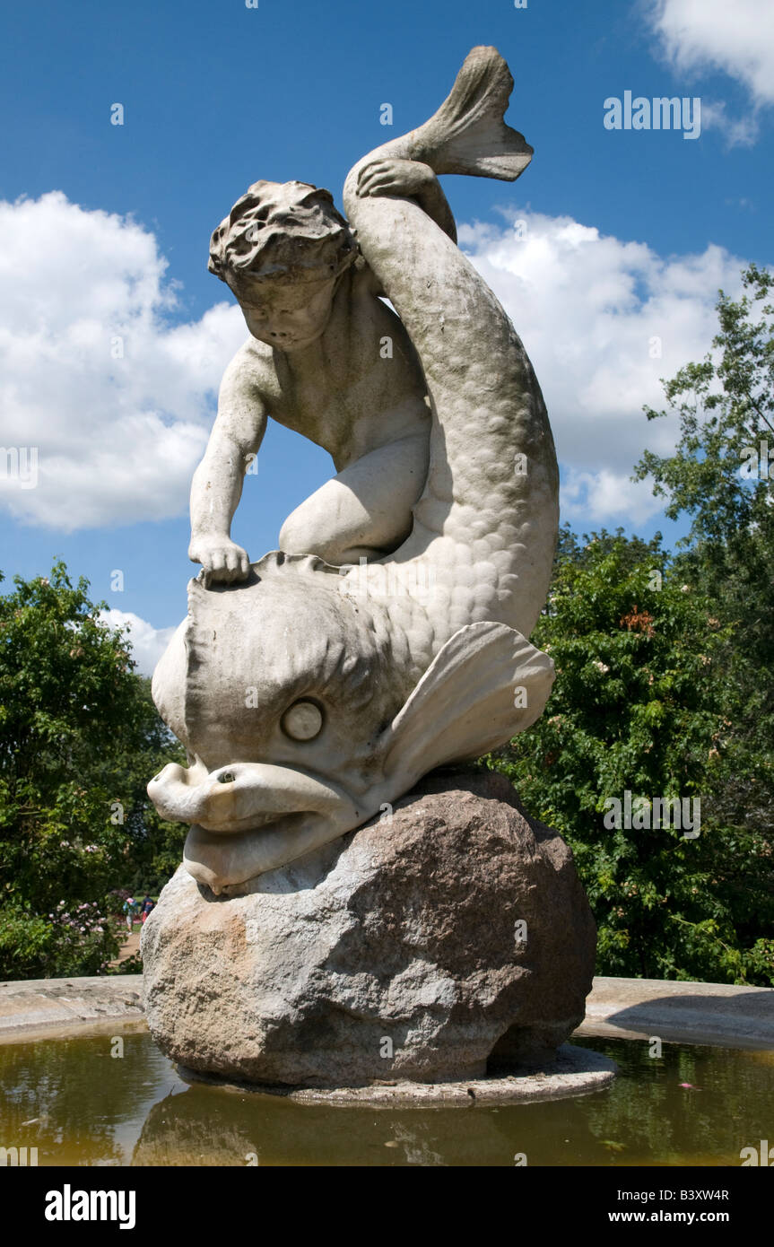 Dolphin and boy statue hi-res stock photography and images - Alamy
