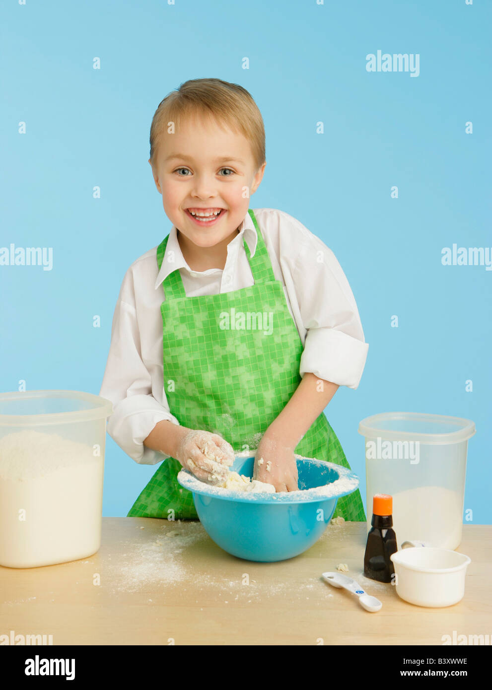 Boy mixing ingredients Stock Photo - Alamy