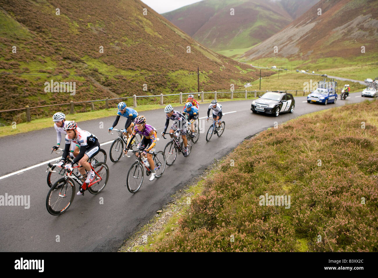Stage 7 of the Tour of Britain cycle race cyclist climbing Mennock Pass ...