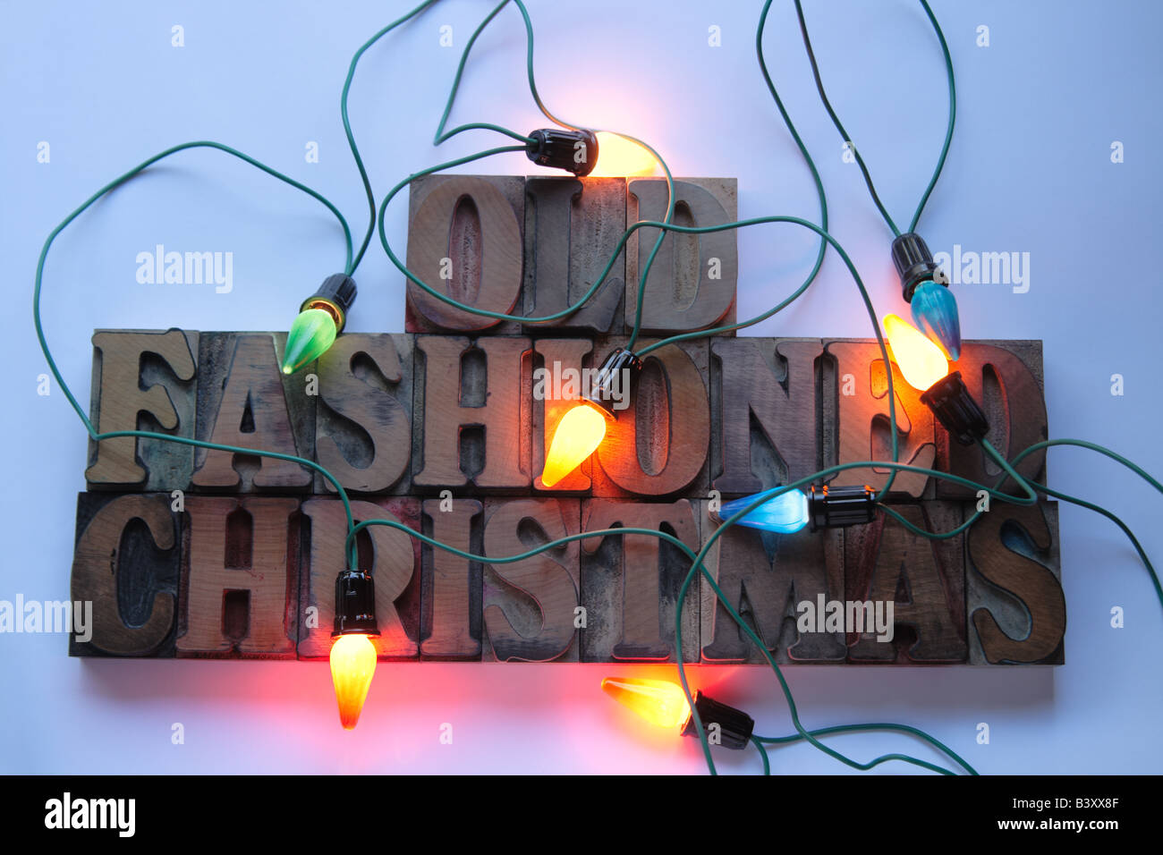 vintage lights atop the words 'old-fashioned Christmas' in old, ink ...