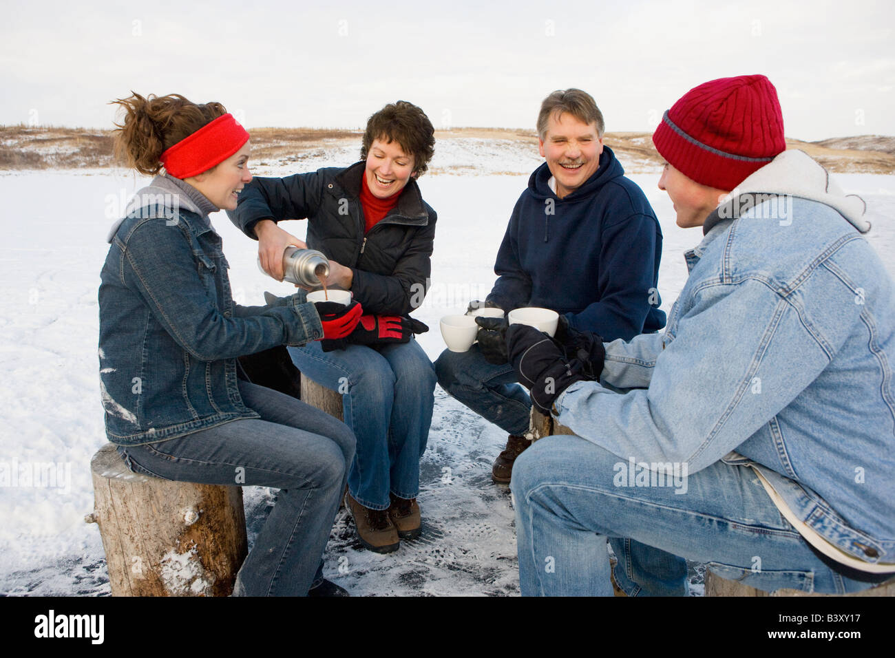 Family drinking hot cocoa Stock Photo - Alamy
