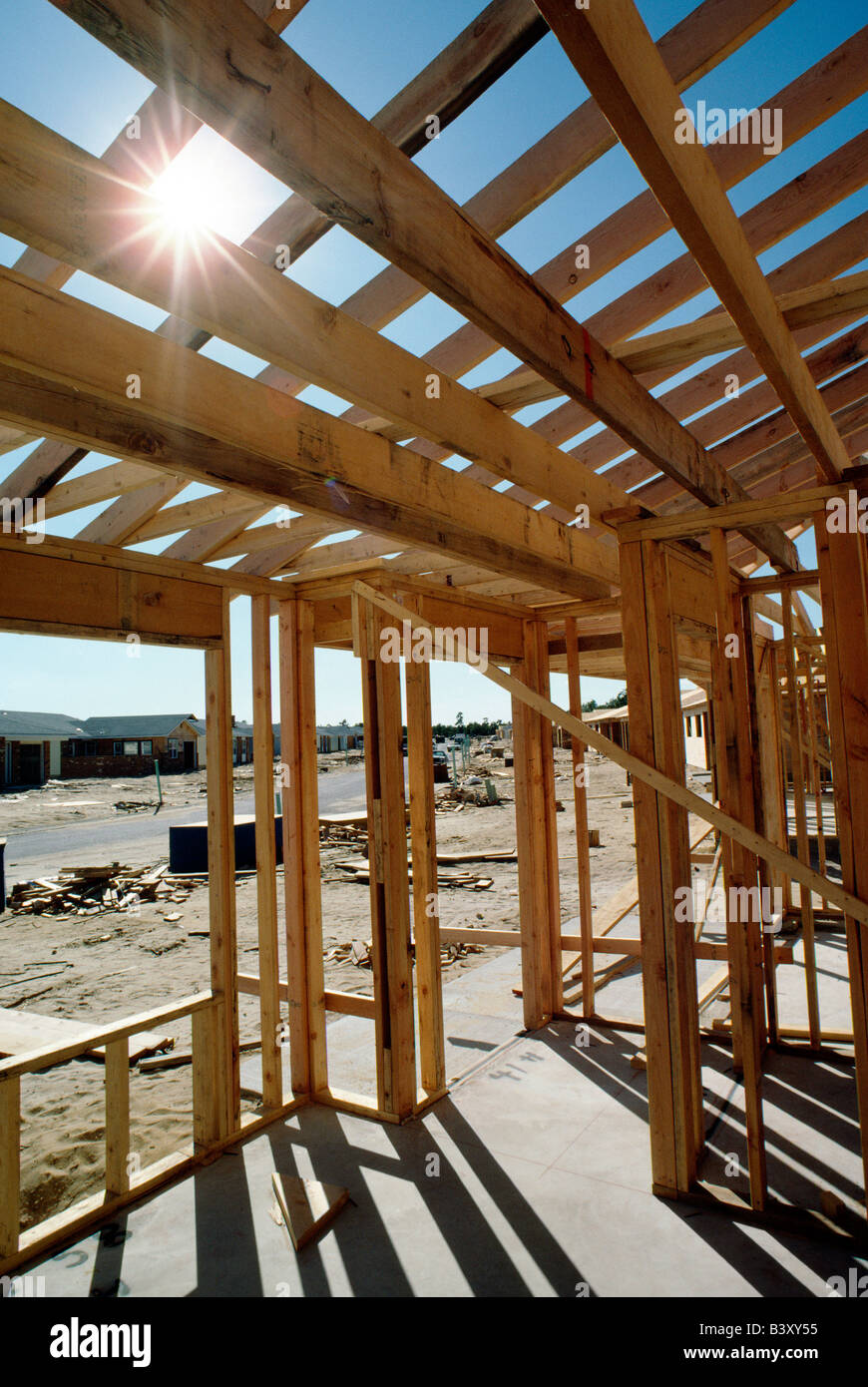 Wooden studs and rafters frame a new house Stock Photo - Alamy