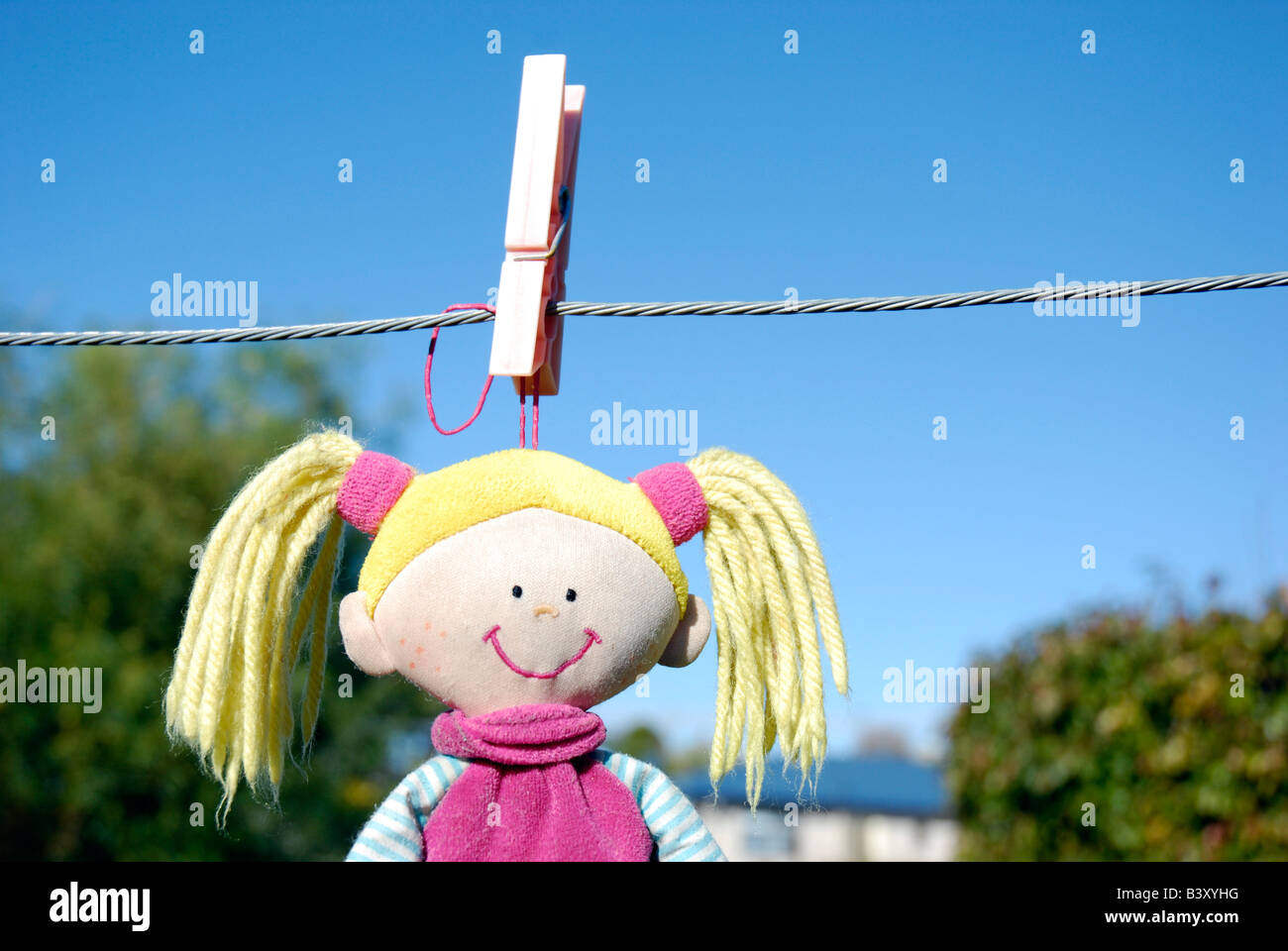 A child s favourite soft toy hanging on washing line to dry after being ...