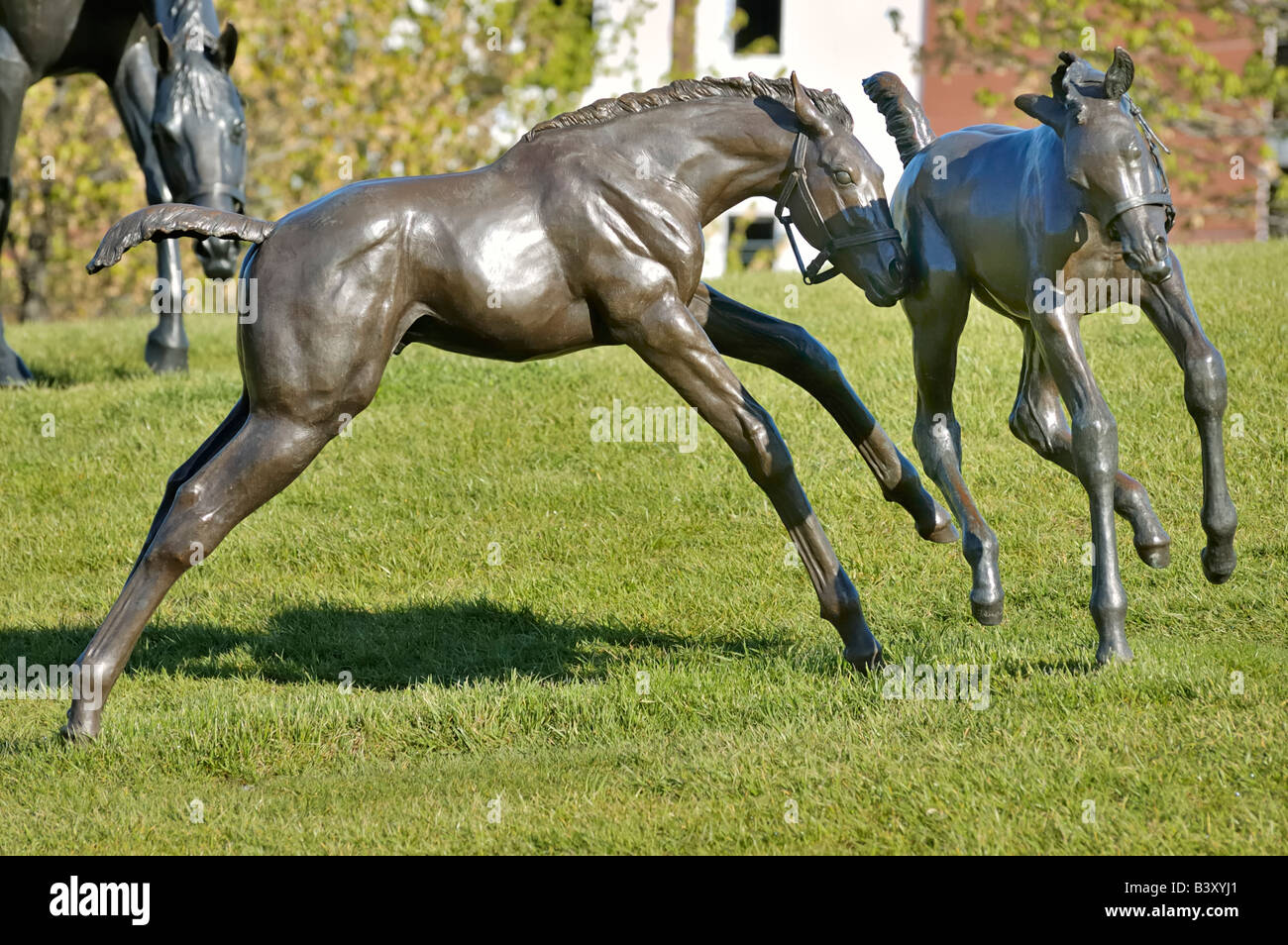 Sculptures of young foals at play Stock Photo - Alamy