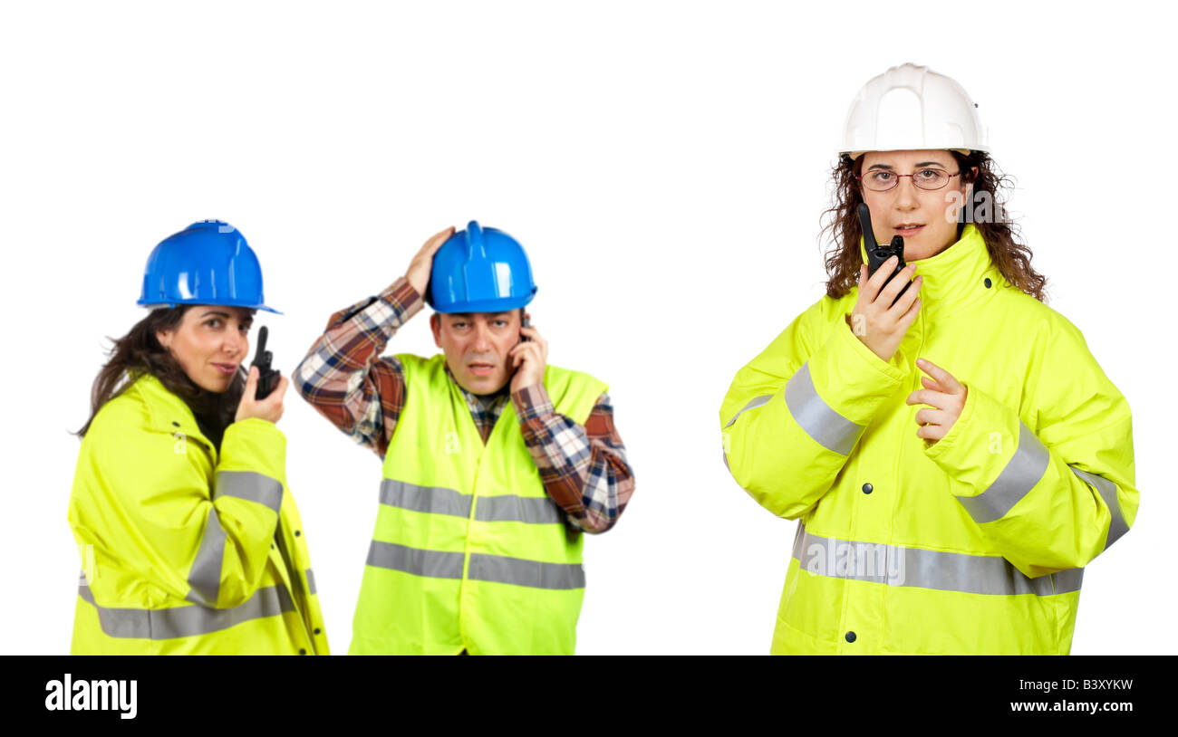 Three construction workers talking with a walkie talkie over a white ...
