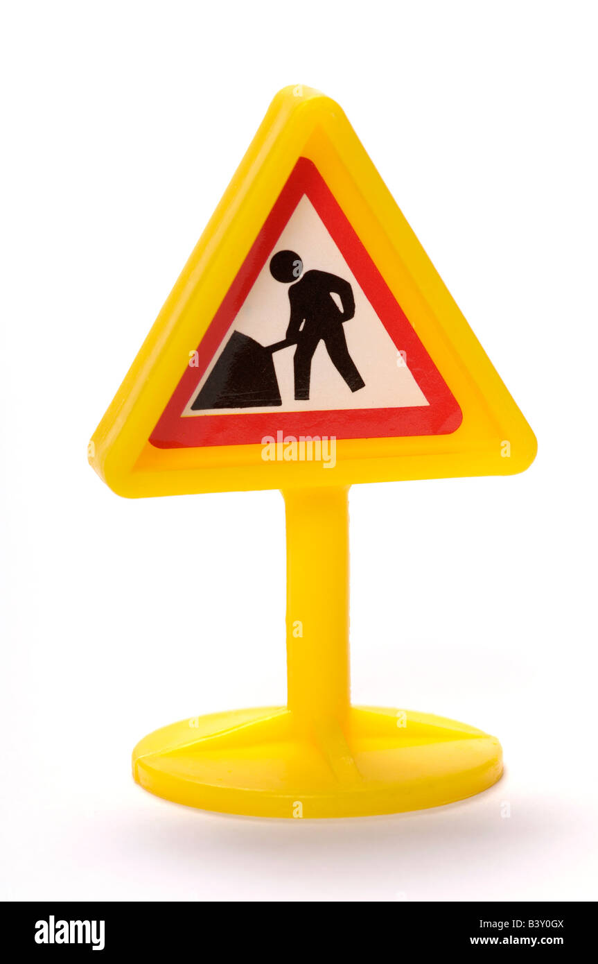 Plastic toy workmen sign Stock Photo - Alamy