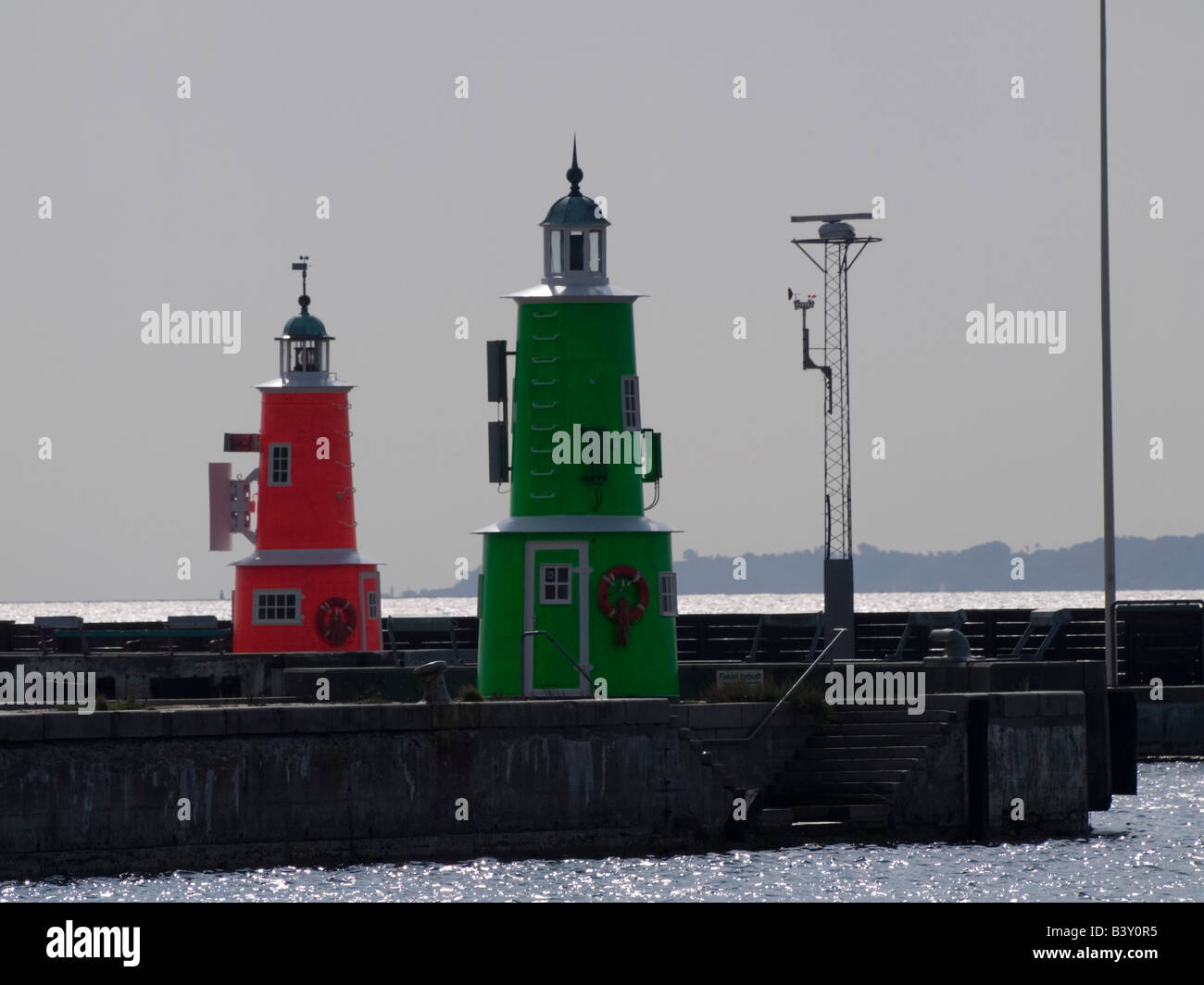 Twin Beacons on the breakwater entrance to the Port of Helsingoer ...
