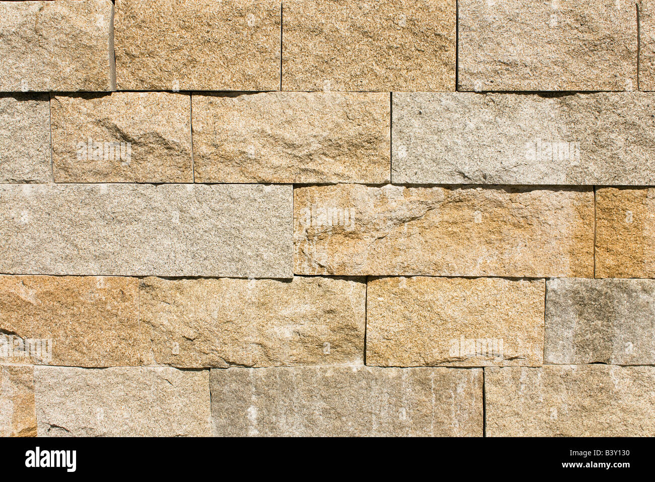 Background of stone wall made with blocks Stock Photo - Alamy