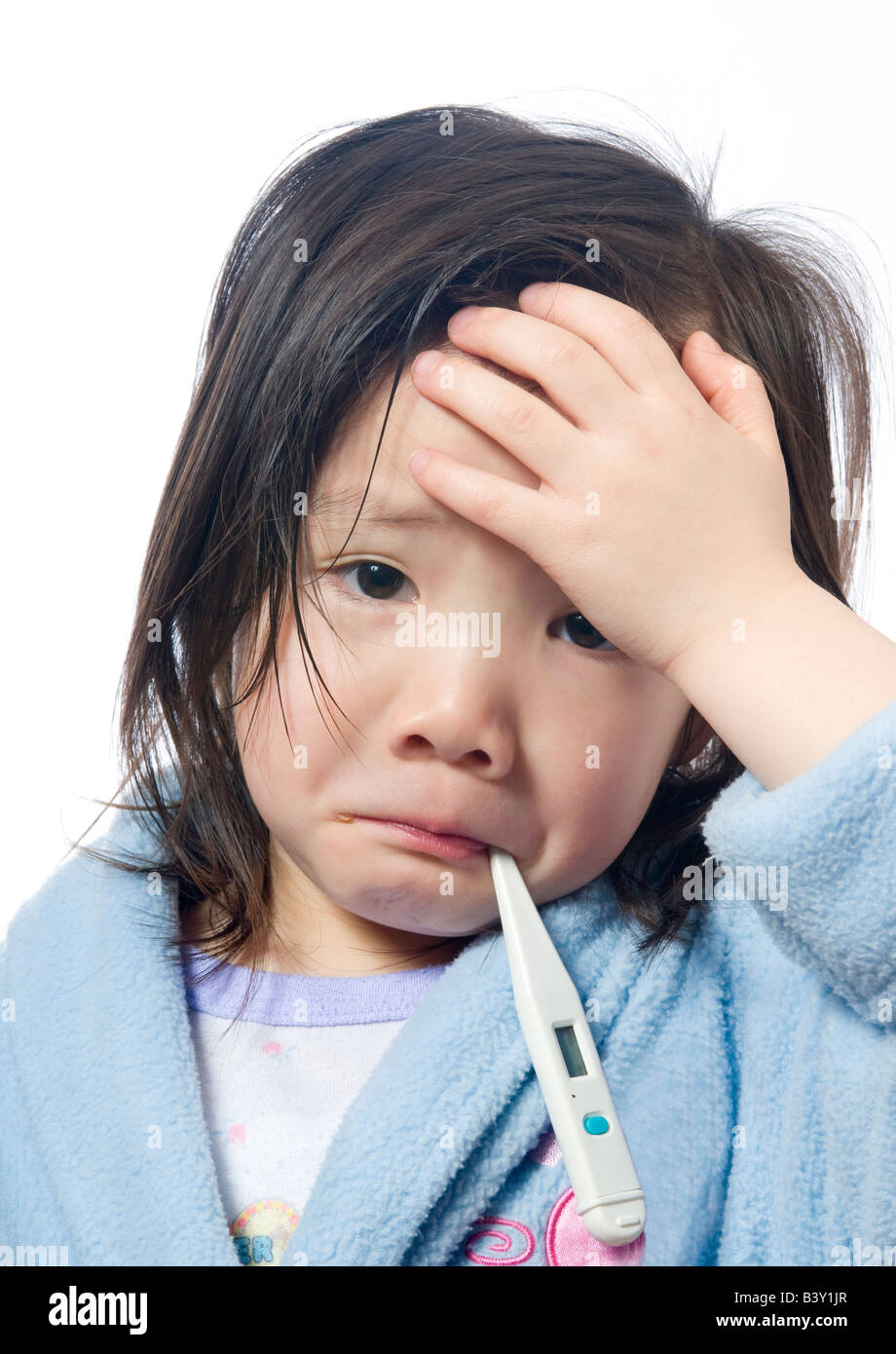 A young girl is sick and having her temperature taken Stock Photo - Alamy