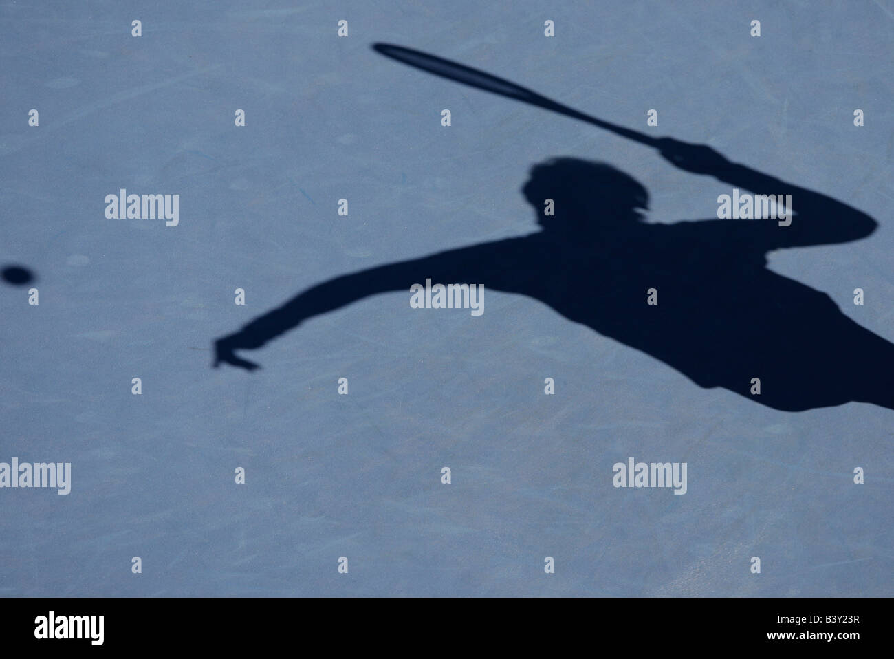 Shadow of a tennis player in action Stock Photo - Alamy