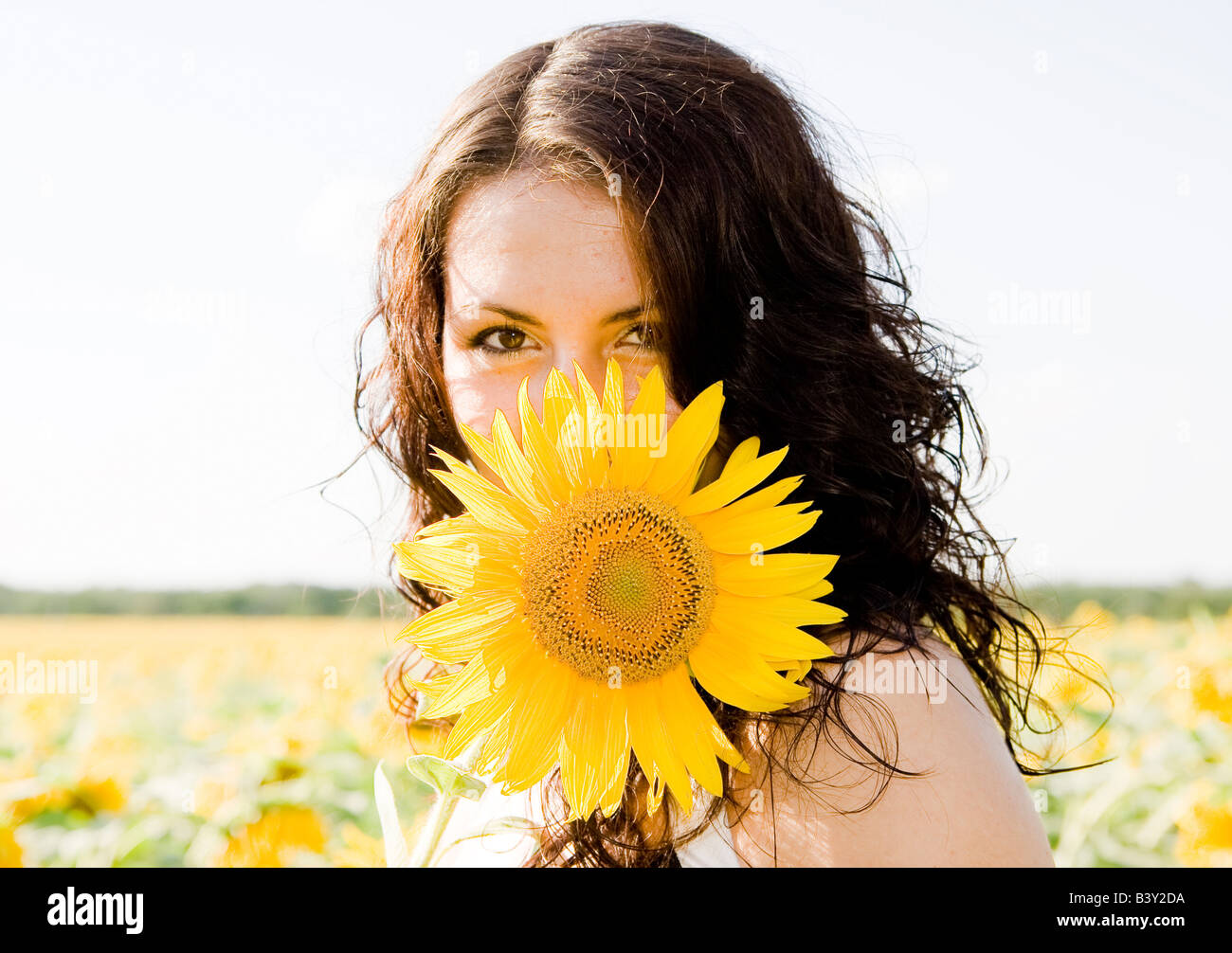 portrait of girl with sunflower Stock Photo - Alamy