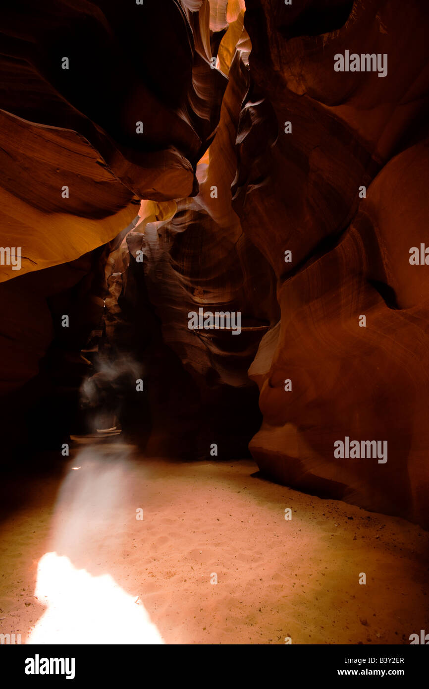 Streaming light beams, shaft of sunlight shining through to inside ...