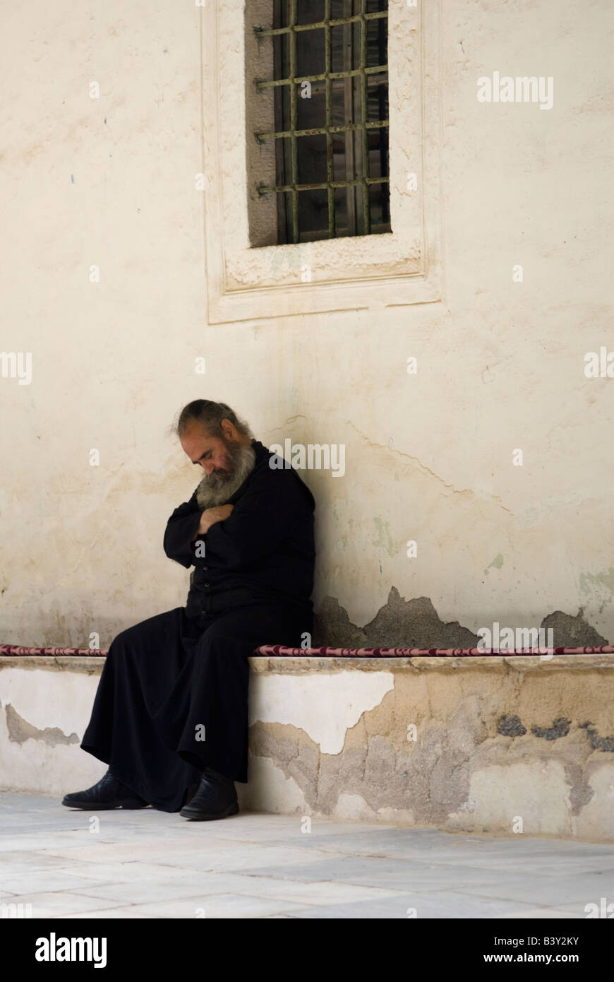 An Eastern Orthodox monk takes a nap at a monastery Stock Photo - Alamy