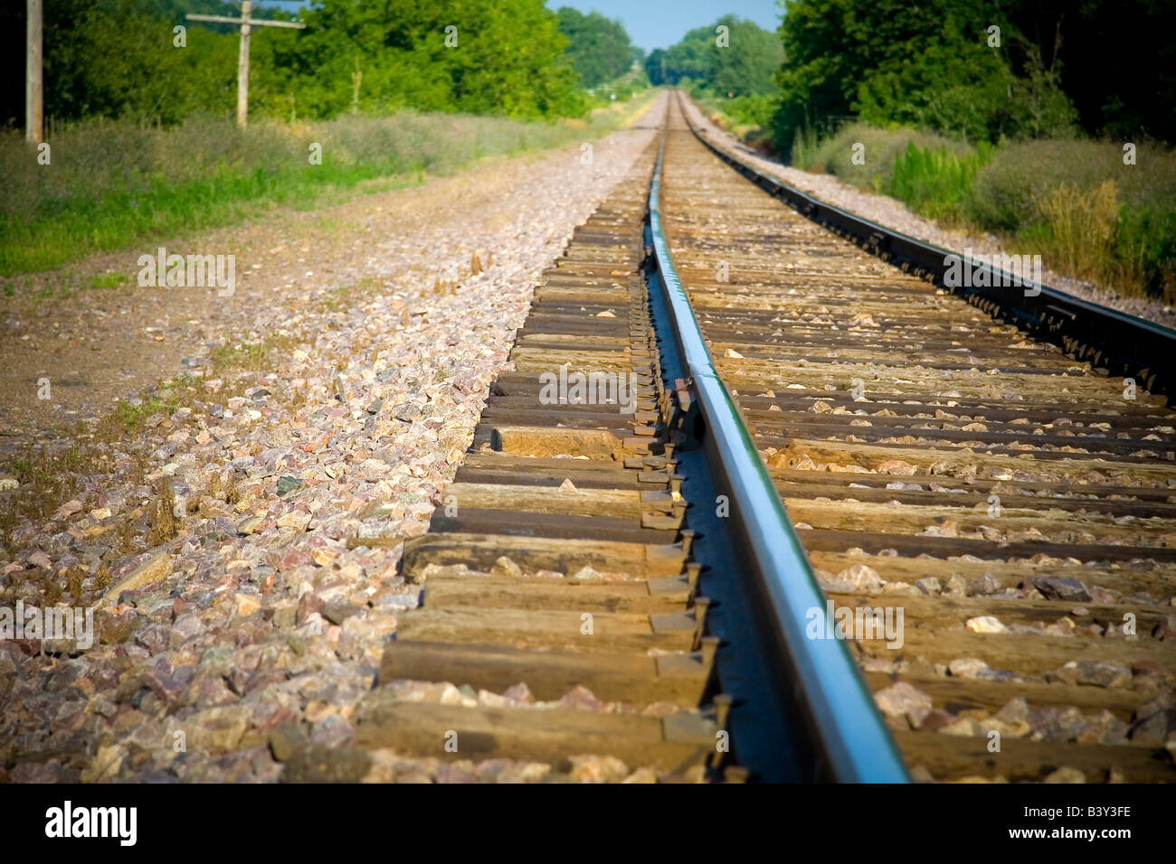 Train tracks running away into the distance Stock Photo - Alamy